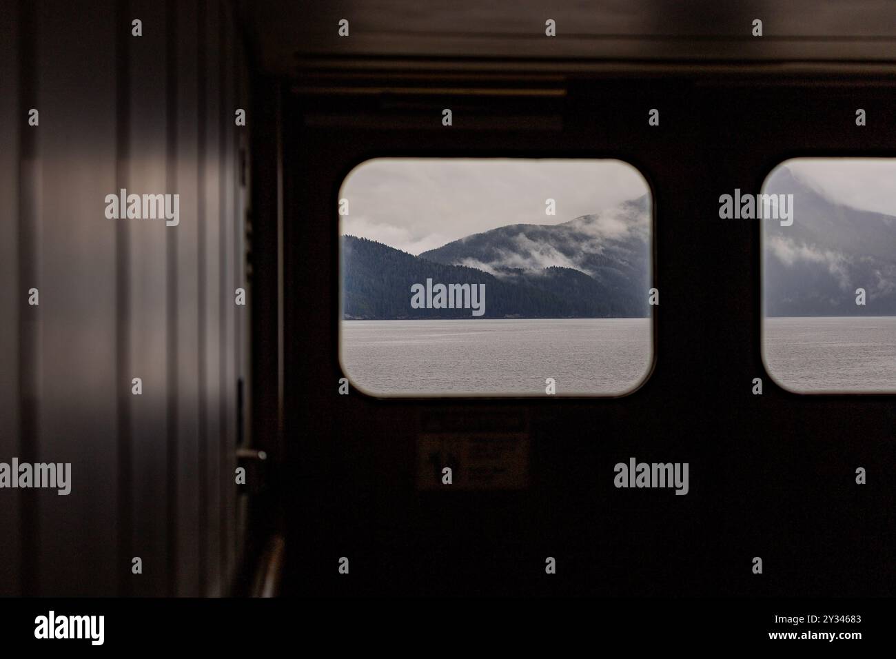 The view of the mountains in Ketchikan harbor from inside a docked ...
