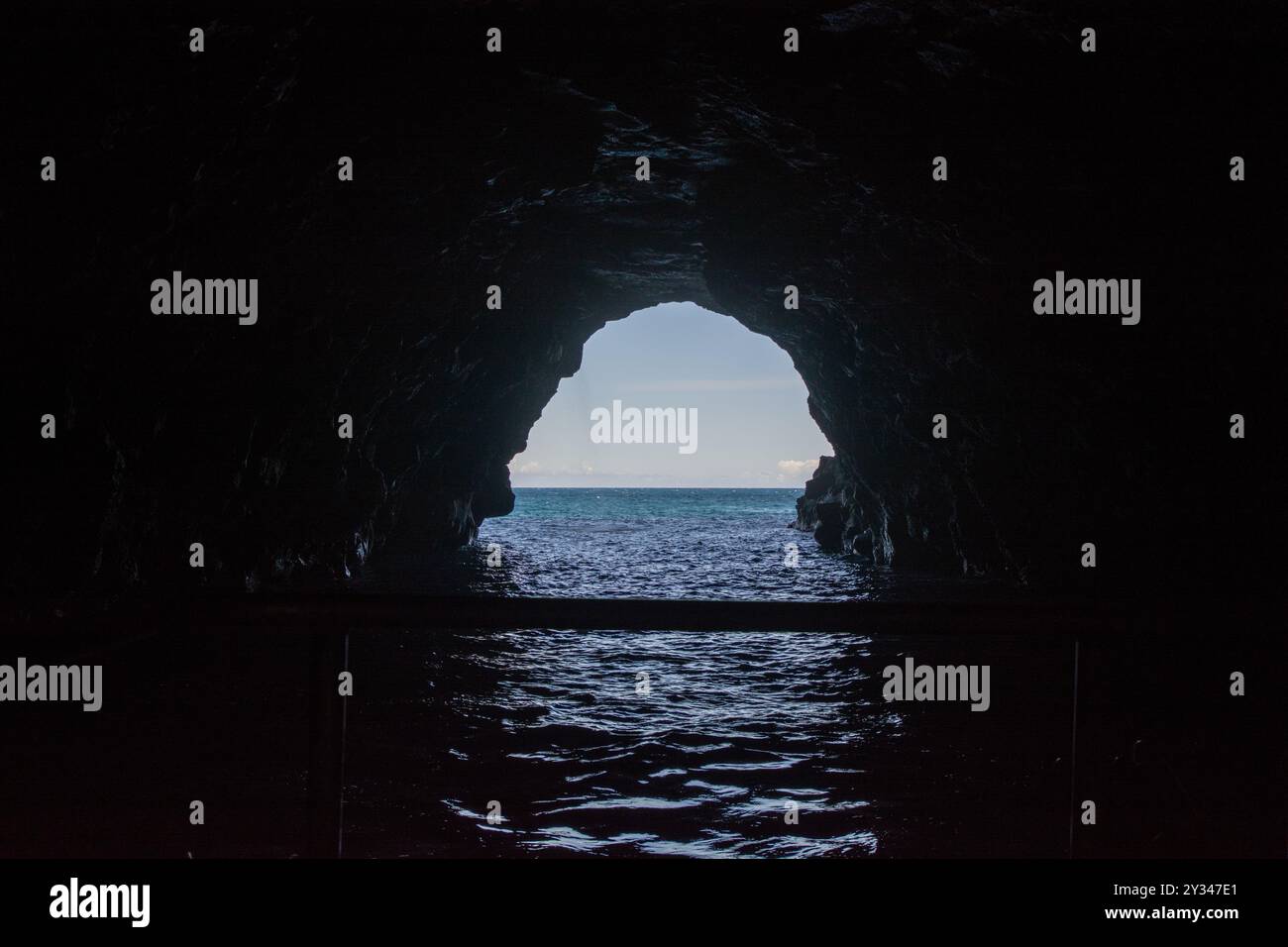 Large cave with clear fresh water near Kalalau Beach in the Na Pali ...