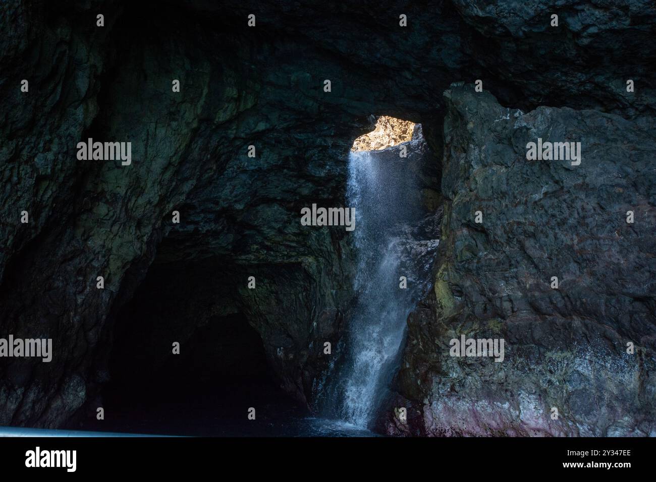 Large cave with clear fresh water near Kalalau Beach in the Na Pali ...