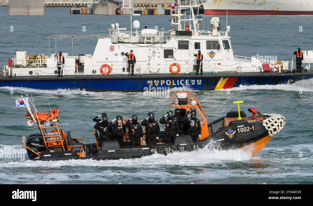 South Korea's Korea Coast Guard (KCG) crew and a high speed boat participatE in a pilot drill at ...
