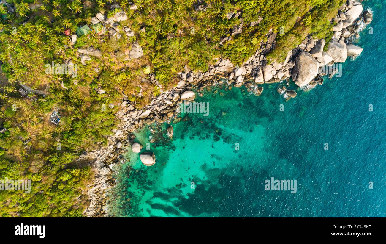 Aerial view drone uav top down birds eye view blue water and coral reef ...