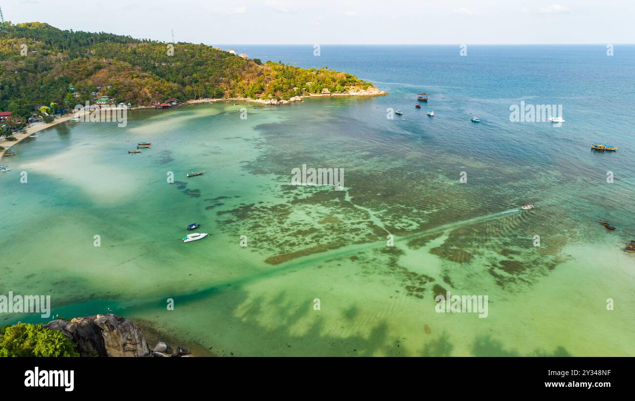 Aerial view drone uav top down birds eye view blue water and coral reef ...