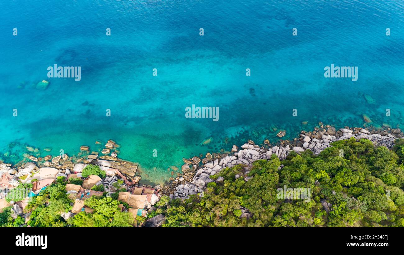 Aerial view drone uav top down birds eye view blue water and coral reef ...