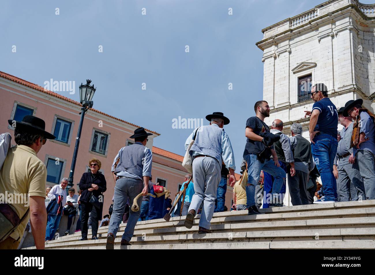 A crowd gathers on the steps outside the Panteão Nacional, with people ...