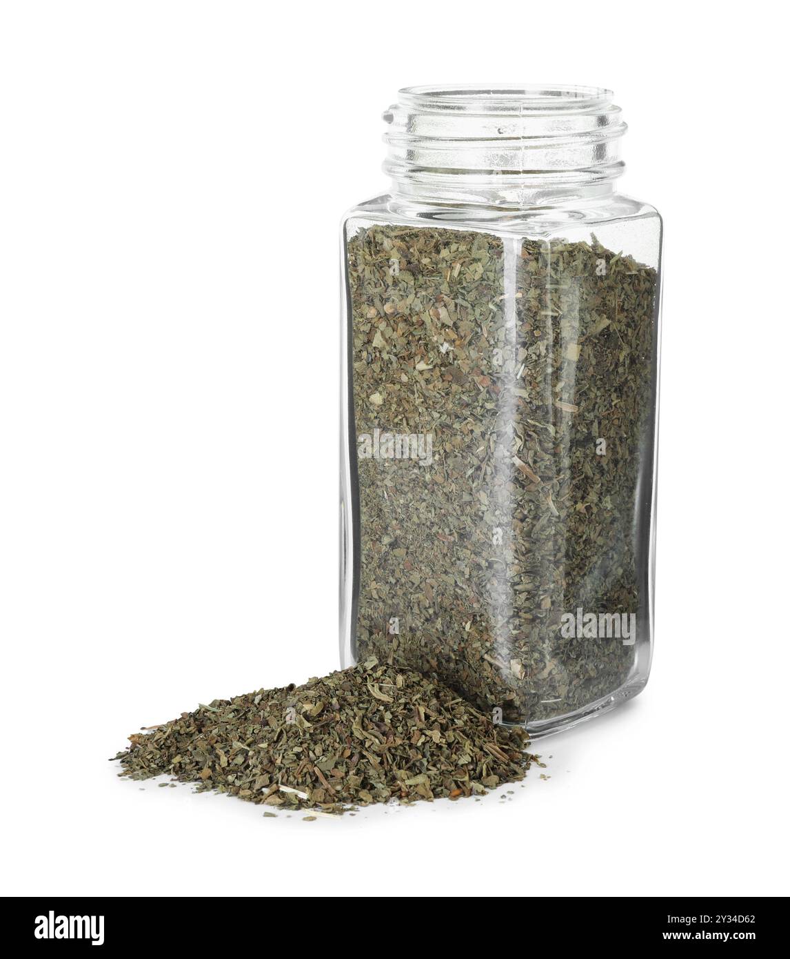 Dry basil in glass jar isolated on white Stock Photo - Alamy
