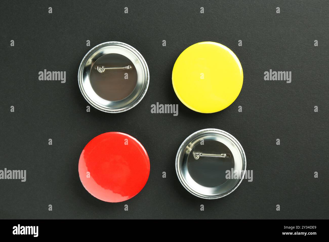 Button badges on black background, flat lay. Mockup for design Stock ...