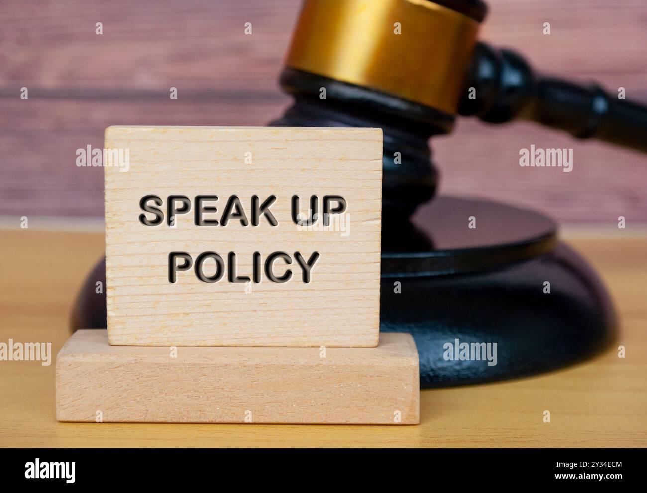 Speak up Policy text engraved on wooden blocks with gavel background ...