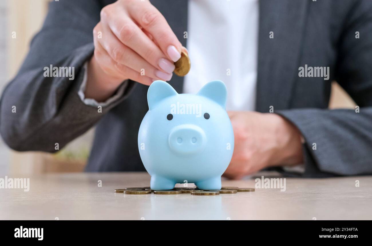 Pig in blue suit hi-res stock photography and images - Alamy