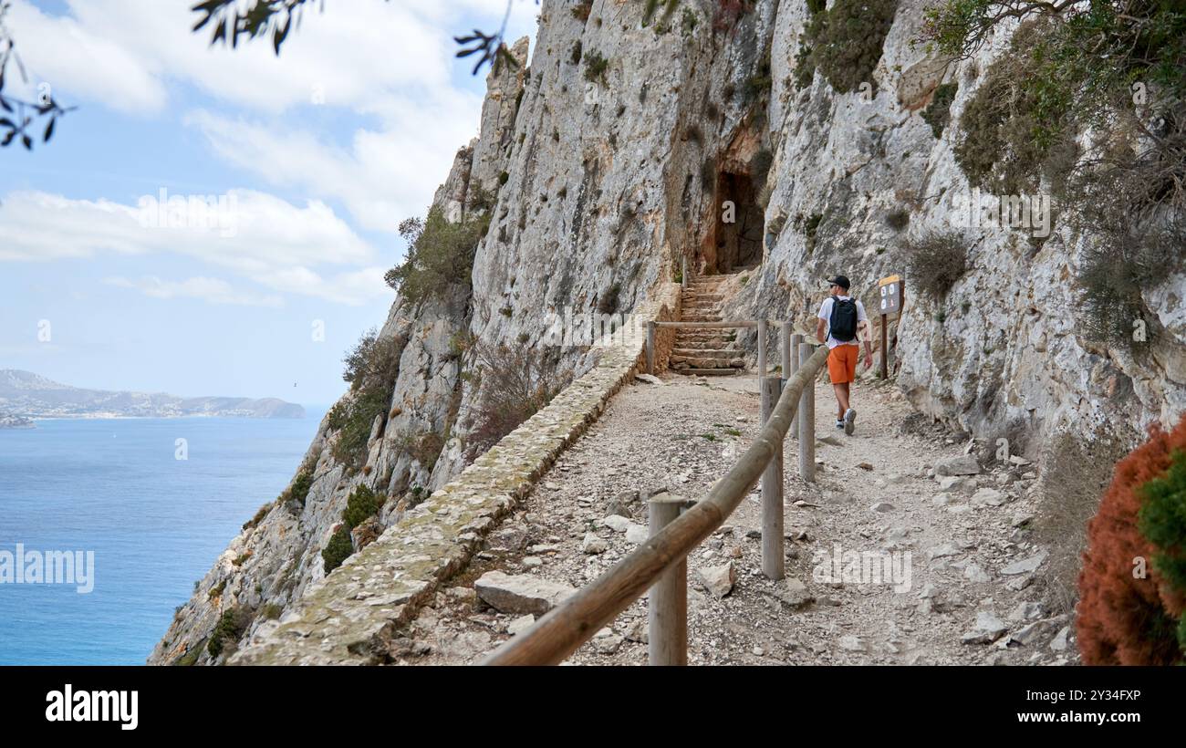 Adventurous Teenage Hiker Explores Dramatic Coastal Cave Entrance Along ...