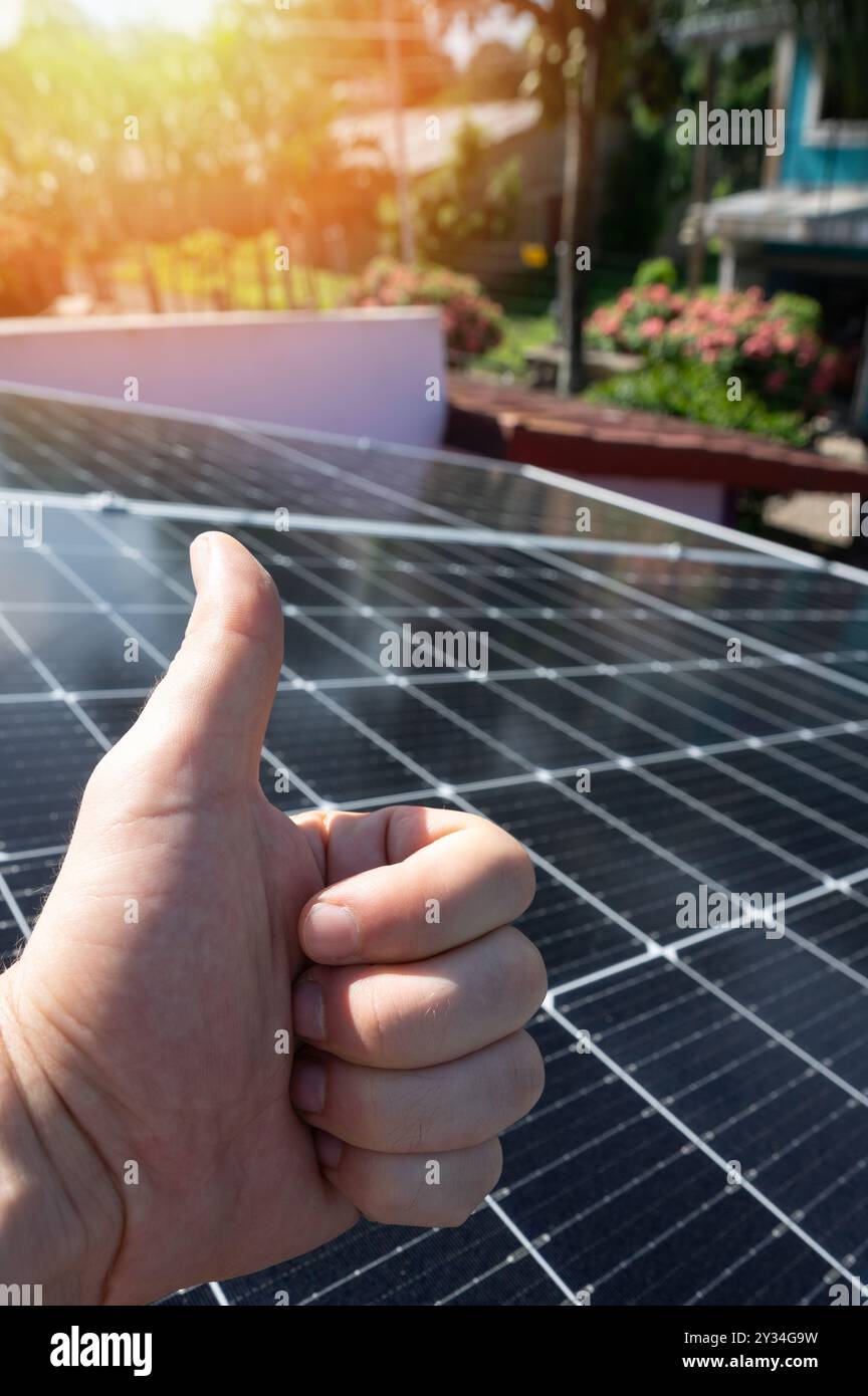 Thumb up gesture on solar panel background close up view Stock Photo ...