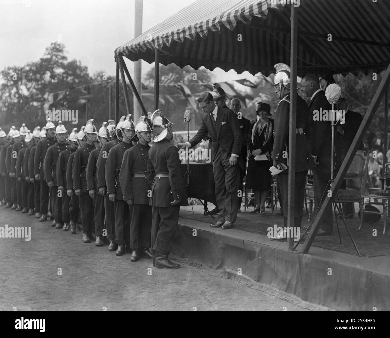Edward VIII, the Prince of Wales, presenting medals to firemen at the ...
