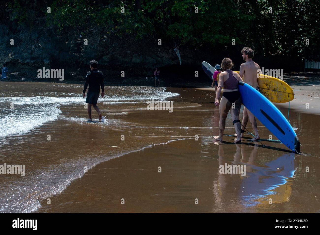 BATUKARAS BEACH SURFING SPOT FOR TOURISTS AND SURFERS Tourists carry ...