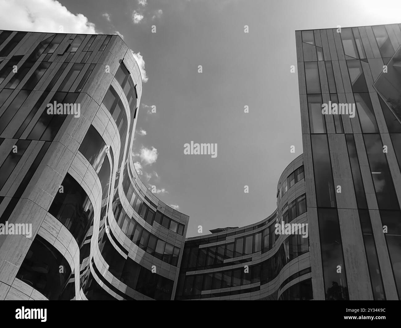 Wave-shaped building in the historic city centre, black and white ...
