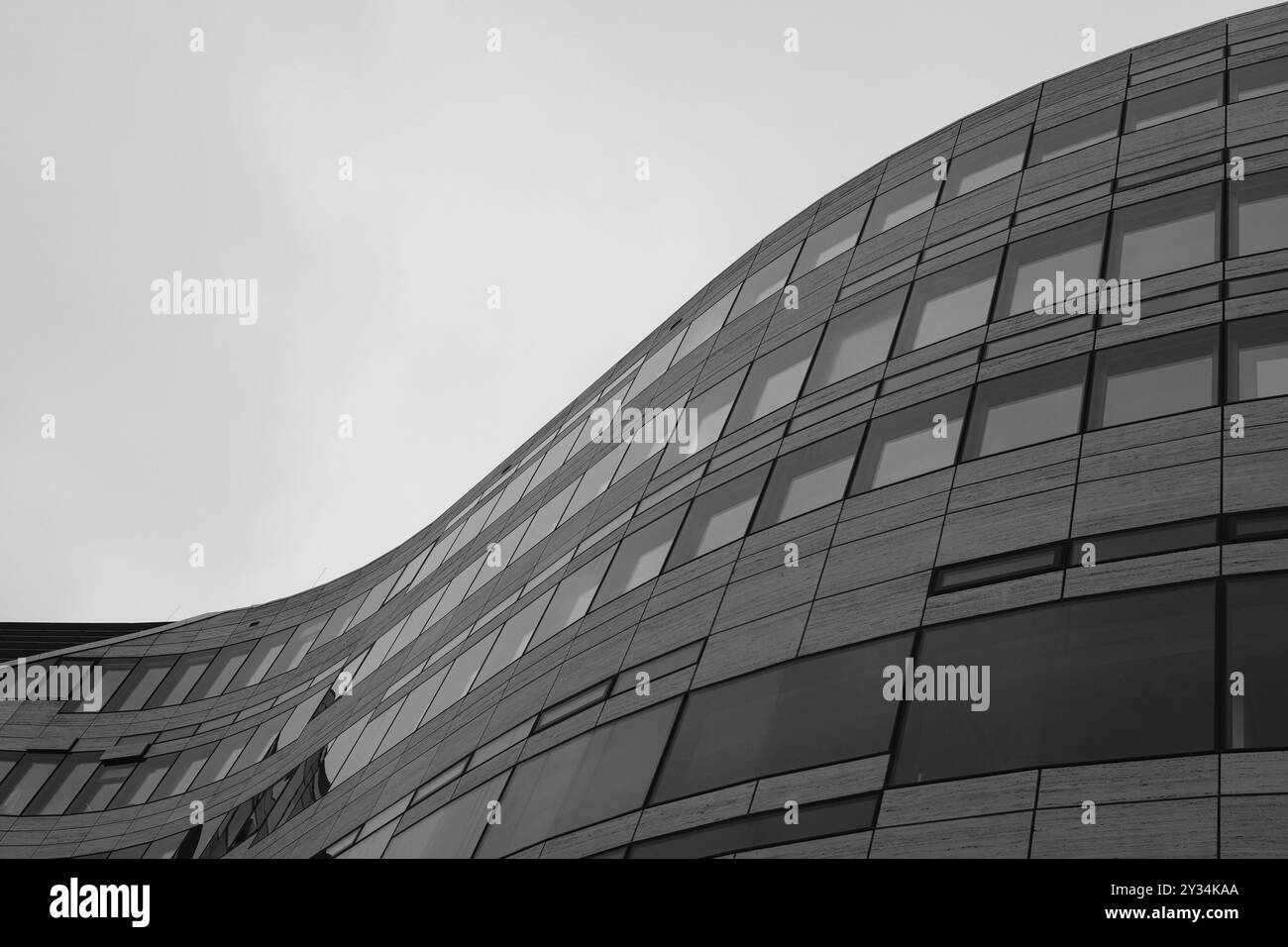 Wave-shaped building in the historic city centre, black and white ...