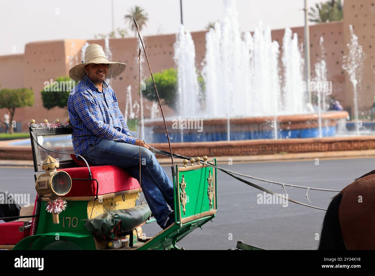 Horse-drawn carriages are used to tour the city of Marrakech, a tourist ...