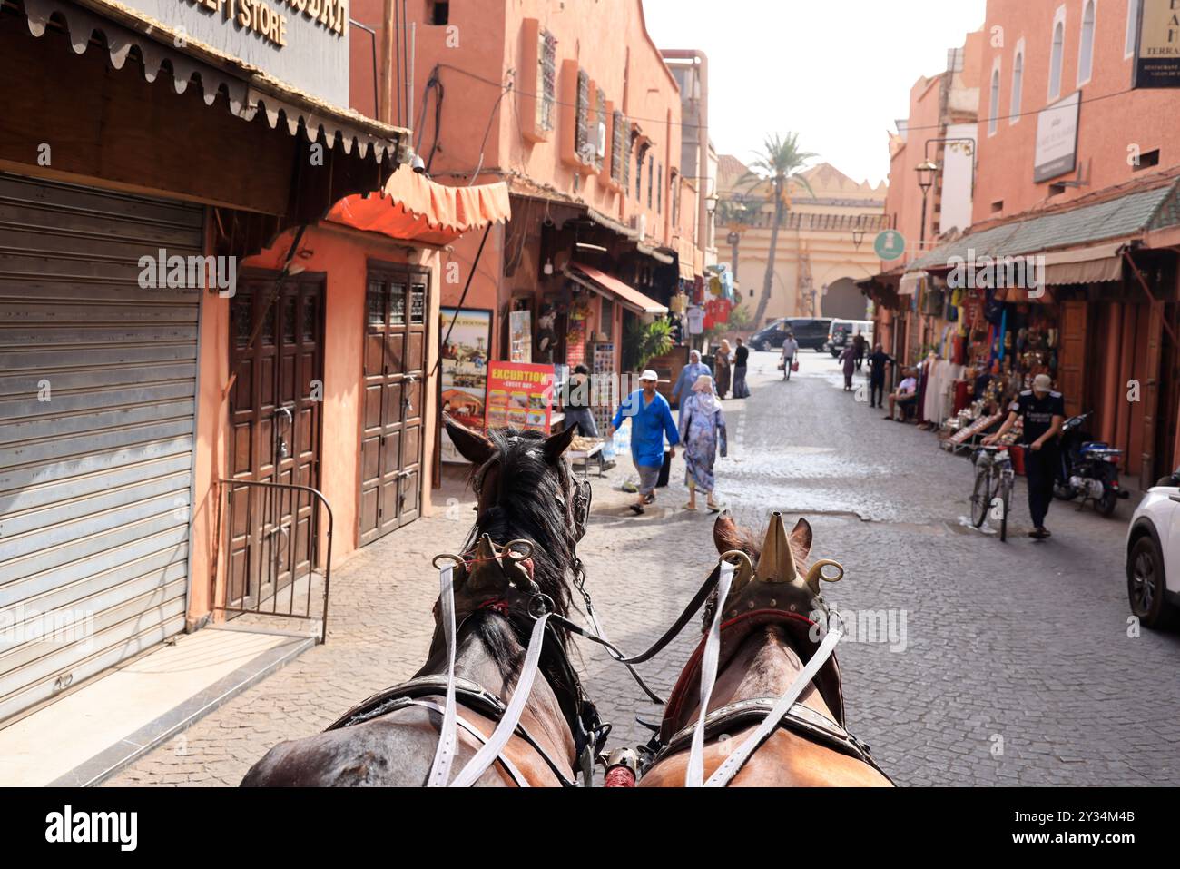 Horse-drawn carriages are used to tour the city of Marrakech, a tourist ...