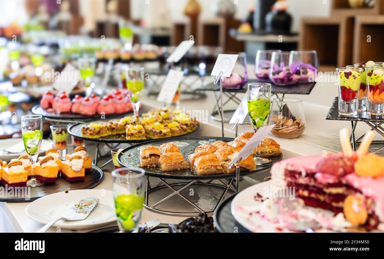 A variety of sweets and cakes. All-inclusive concept Stock Photo - Alamy