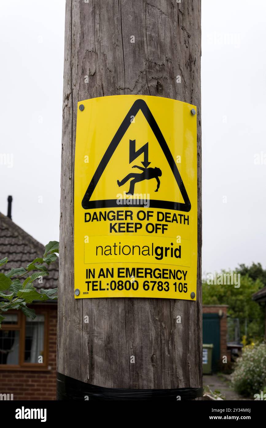 National grid warning notice Stock Photo - Alamy