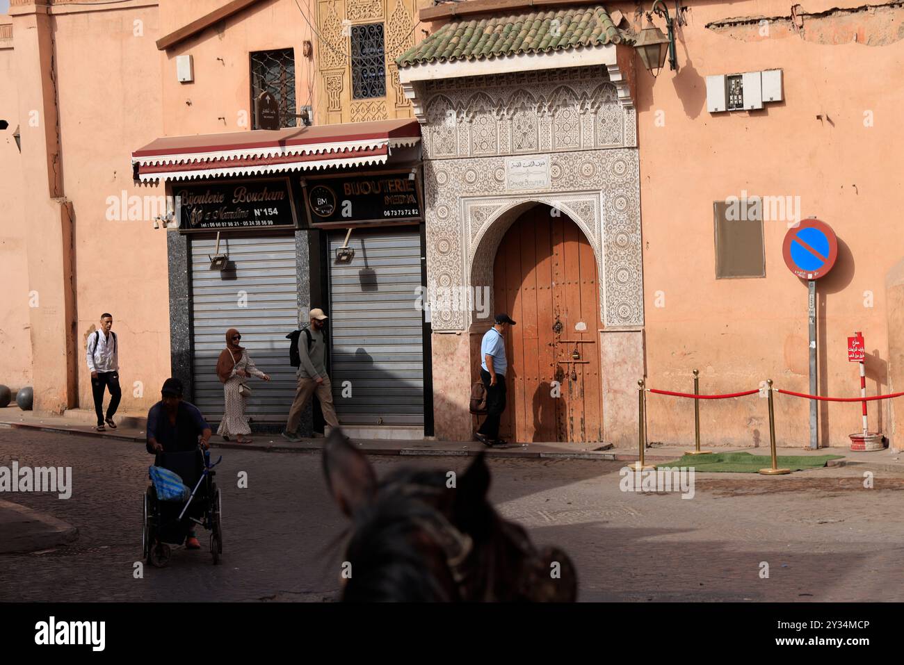 Horse-drawn carriages are used to tour the city of Marrakech, a tourist ...