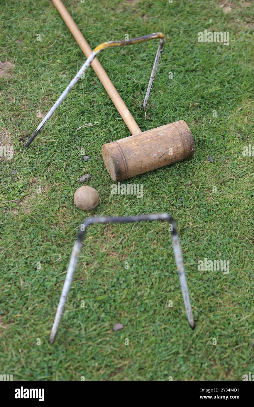 Croquet mallets hoops ball on a lawn grass pastime summer garden ...