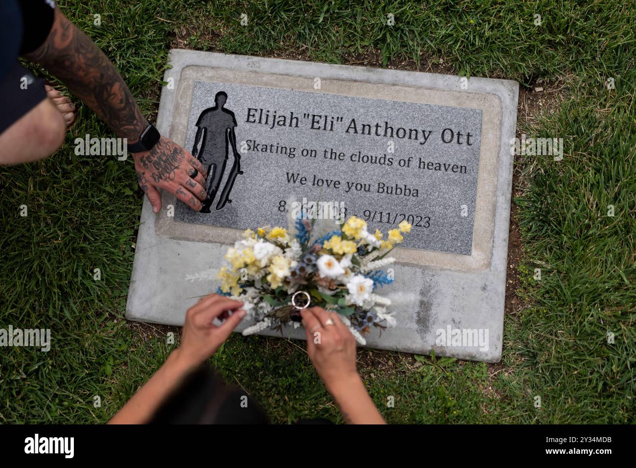 Mikayla Brown and her husband, Tyler, visit the grave of their son ...