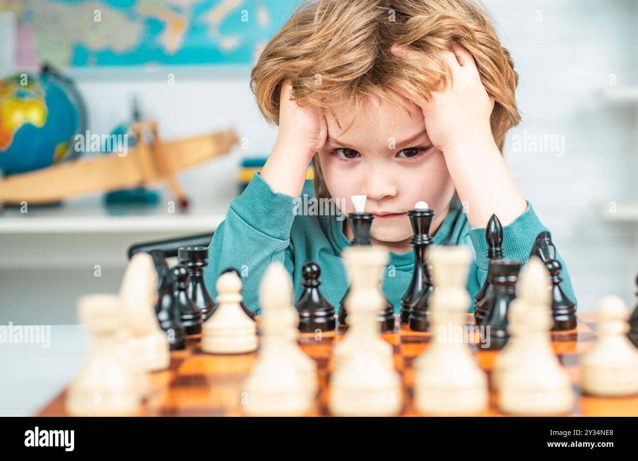 Chess, success and winning. Clever concentrated and thinking child ...
