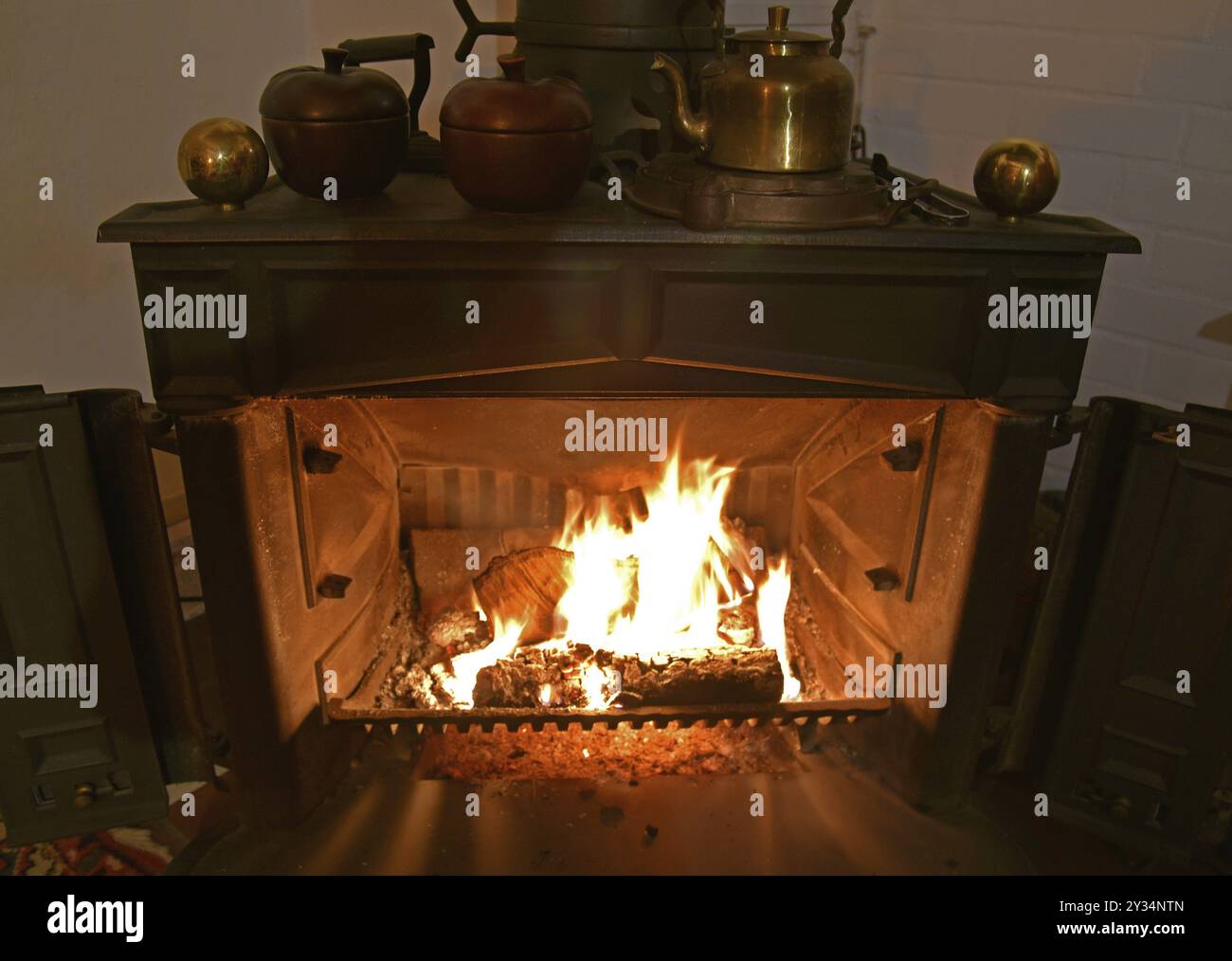 Fire, open fire, wood fire, embers, Franklin wood-burning stove made of ...