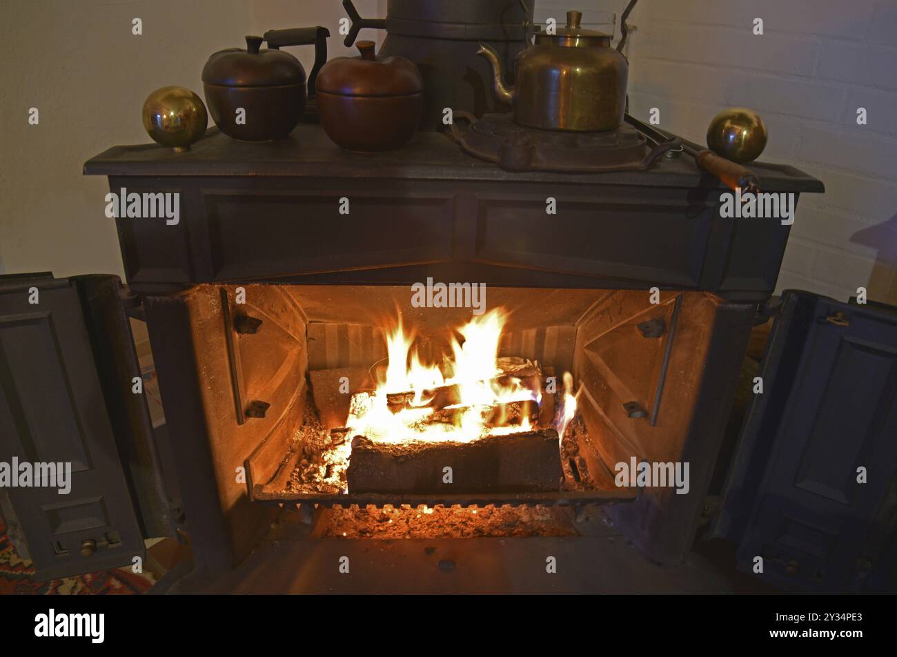 Fire, open fire, wood fire, embers, Franklin wood-burning stove made of ...