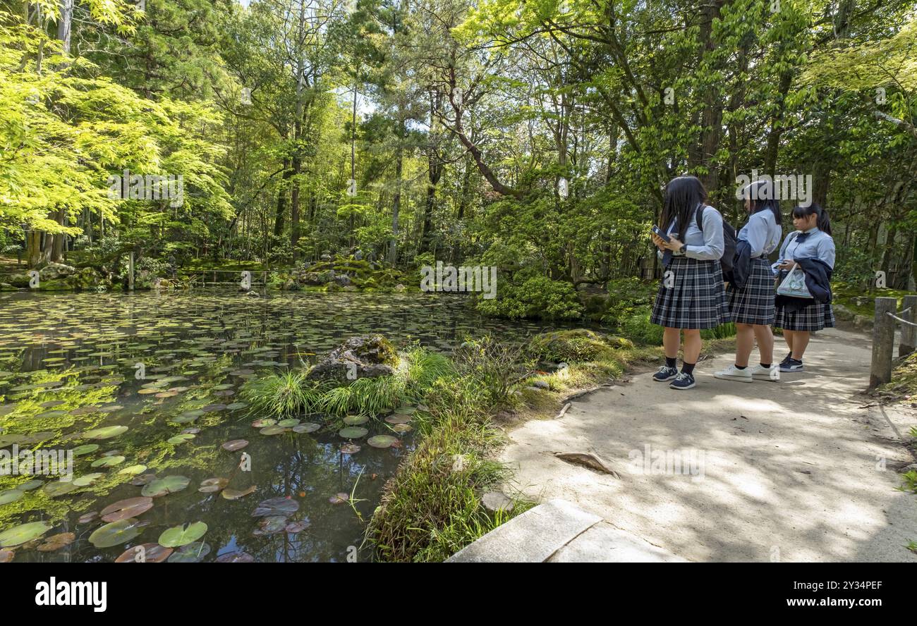 Japanese school children in uniforms visit the Tenjuan Garden, Nanzen ...