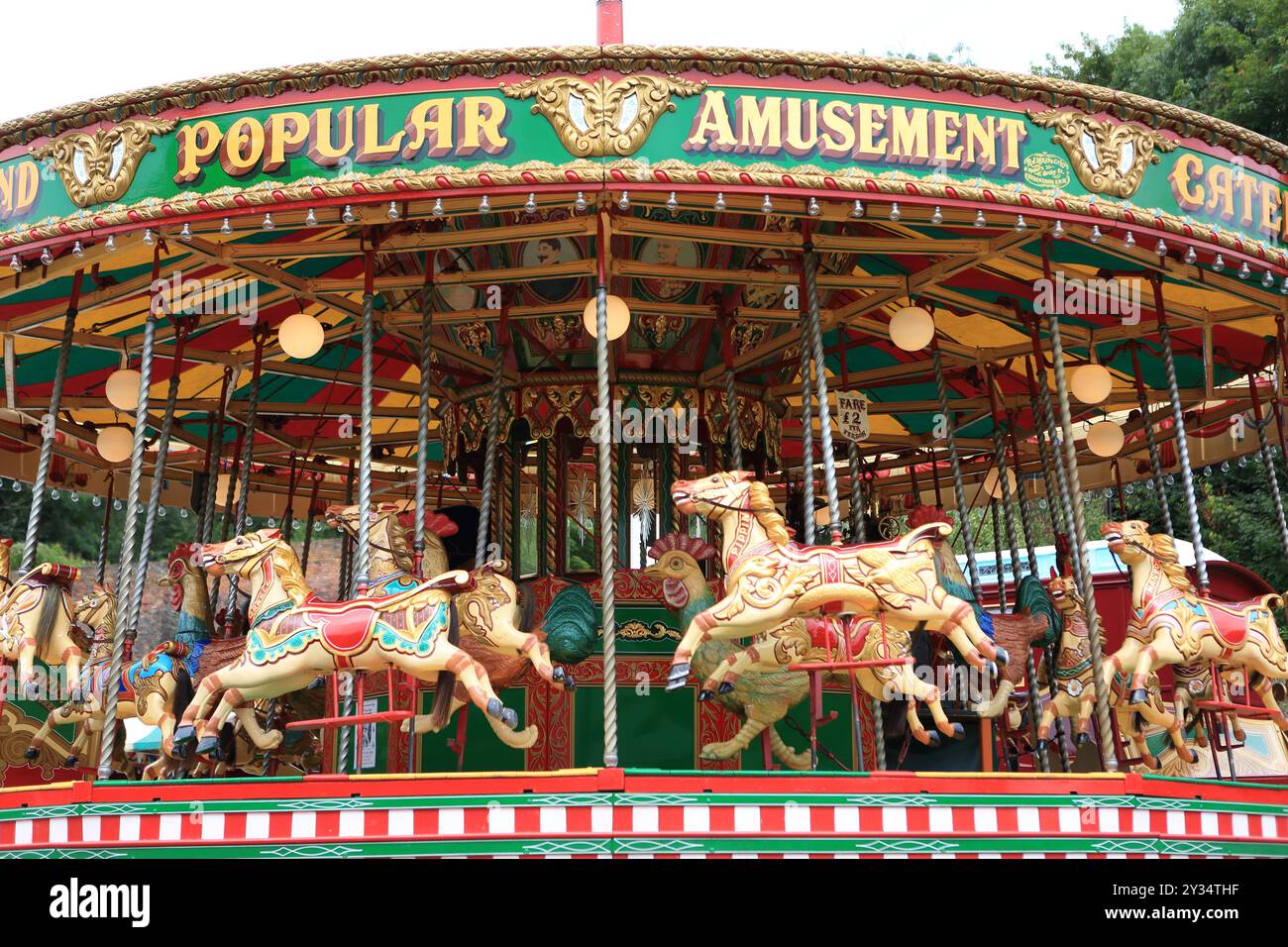 Vintage fairground waltzer popular amusement horses Stock Photo - Alamy