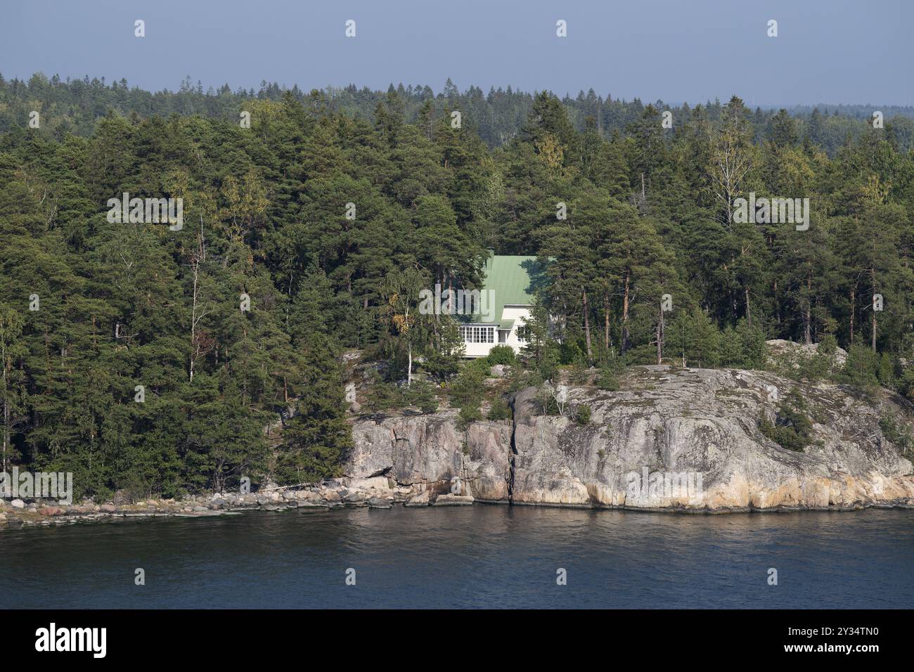 House with a green roof on an archipelago island off Helsinki, Finland ...