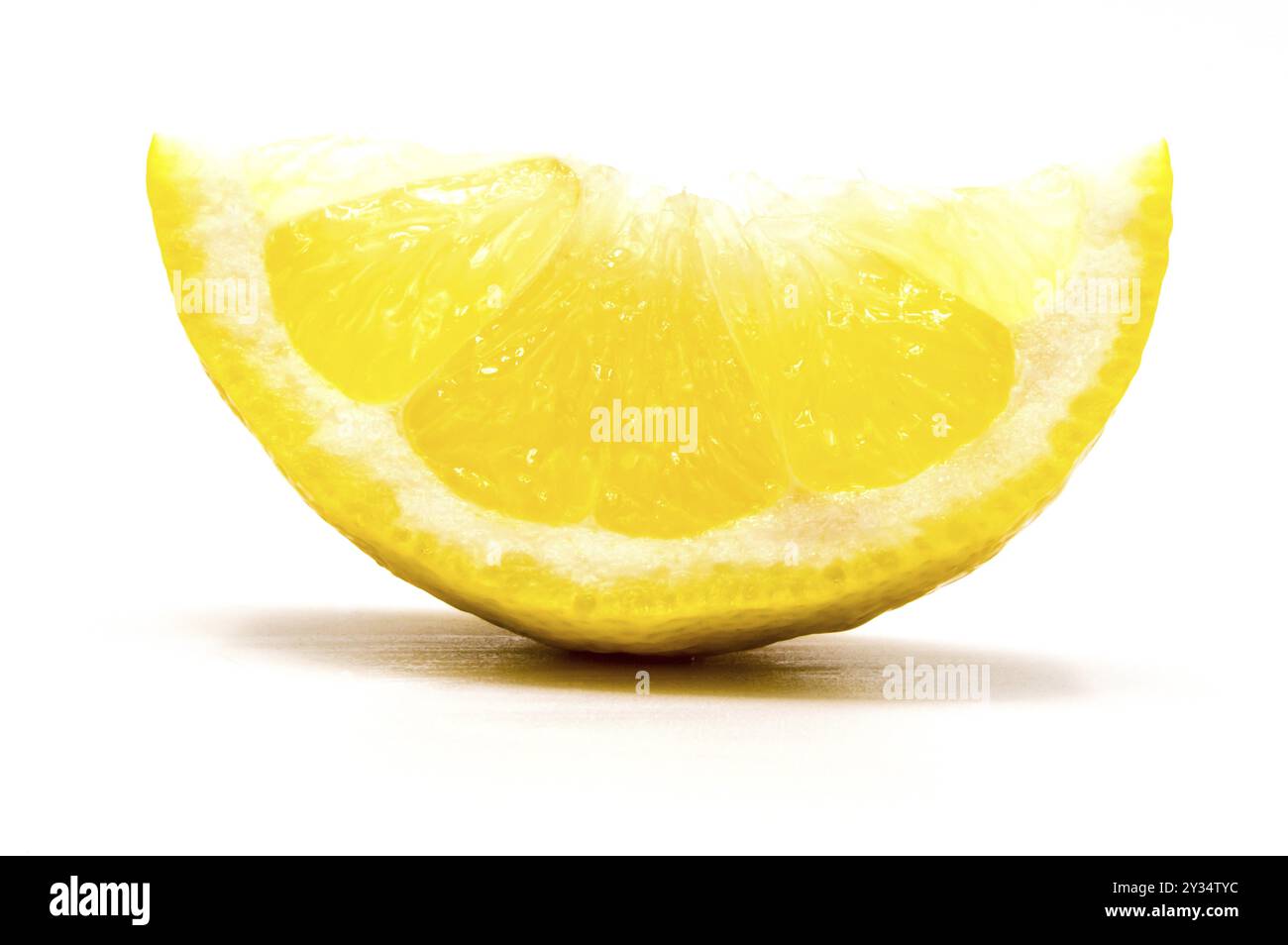 Close up on a slice of fresh lemon wedge isolated on white background as a packaging design ...