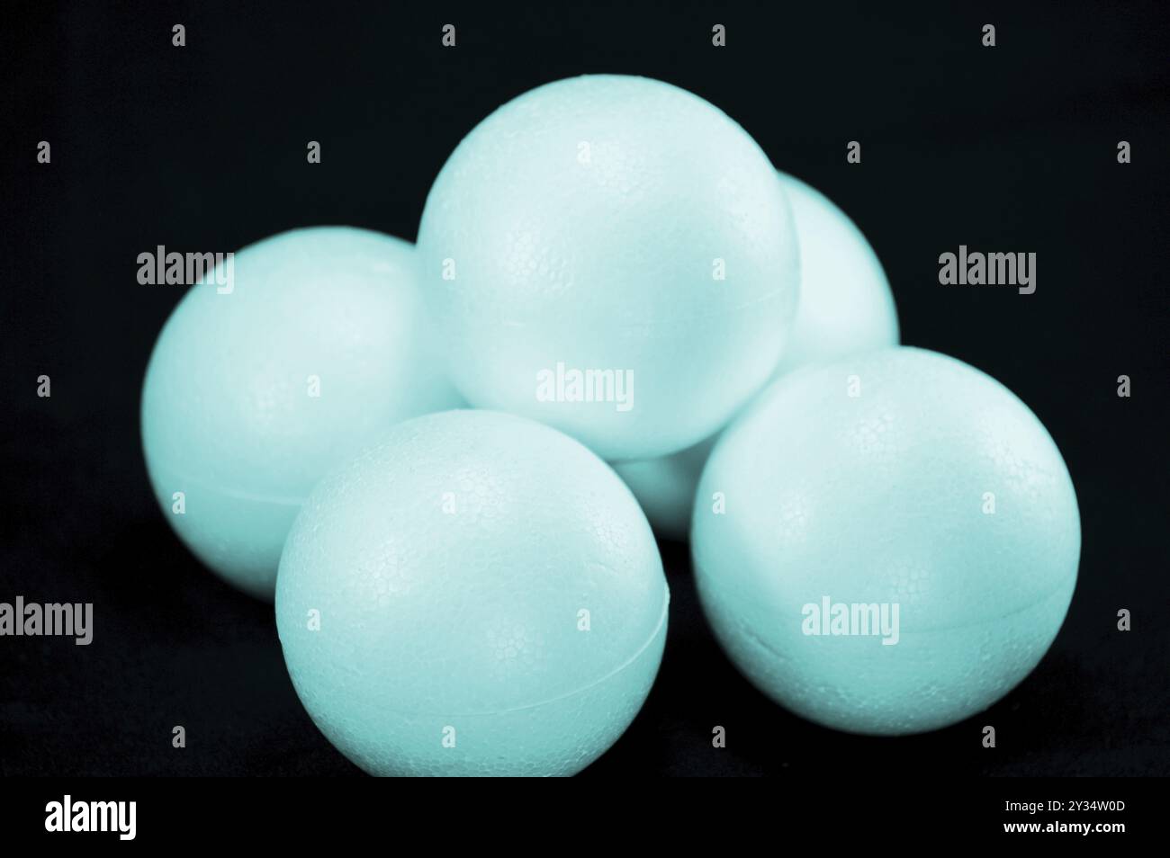 Pyramid of five spheres it frigolite of color blue Stock Photo - Alamy