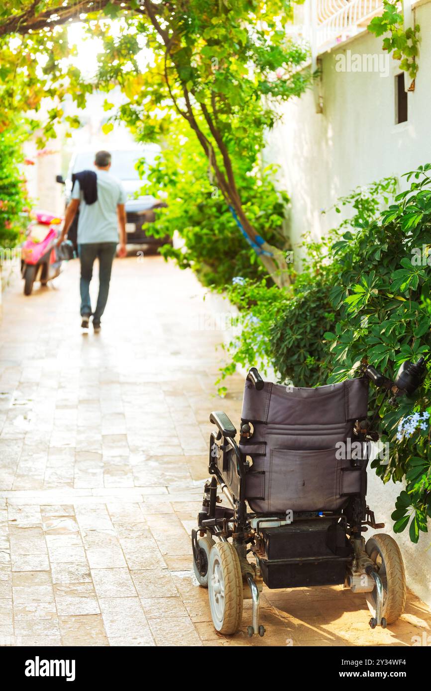 wheelchair parked directly on the garden path Stock Photo - Alamy