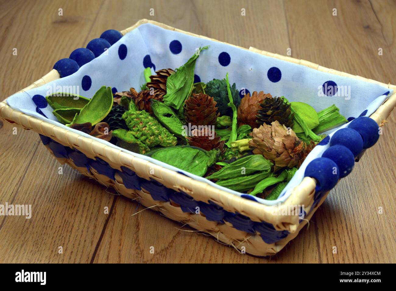 Small basket with flowers and plantes de colors green, red, blue and ...
