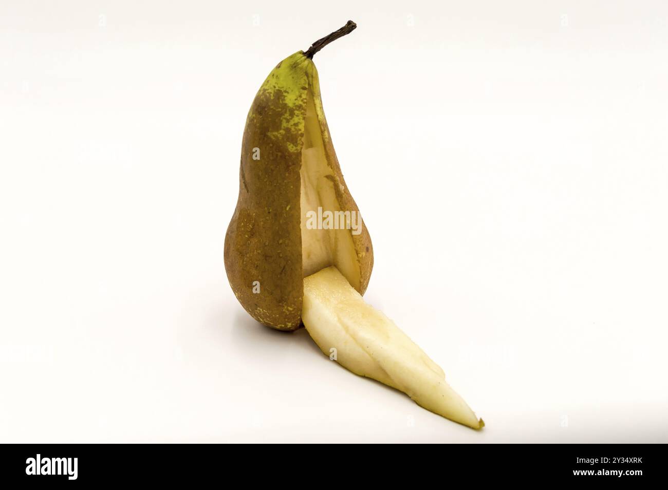 Pear standing with a cut out piece on a white background Stock Photo ...