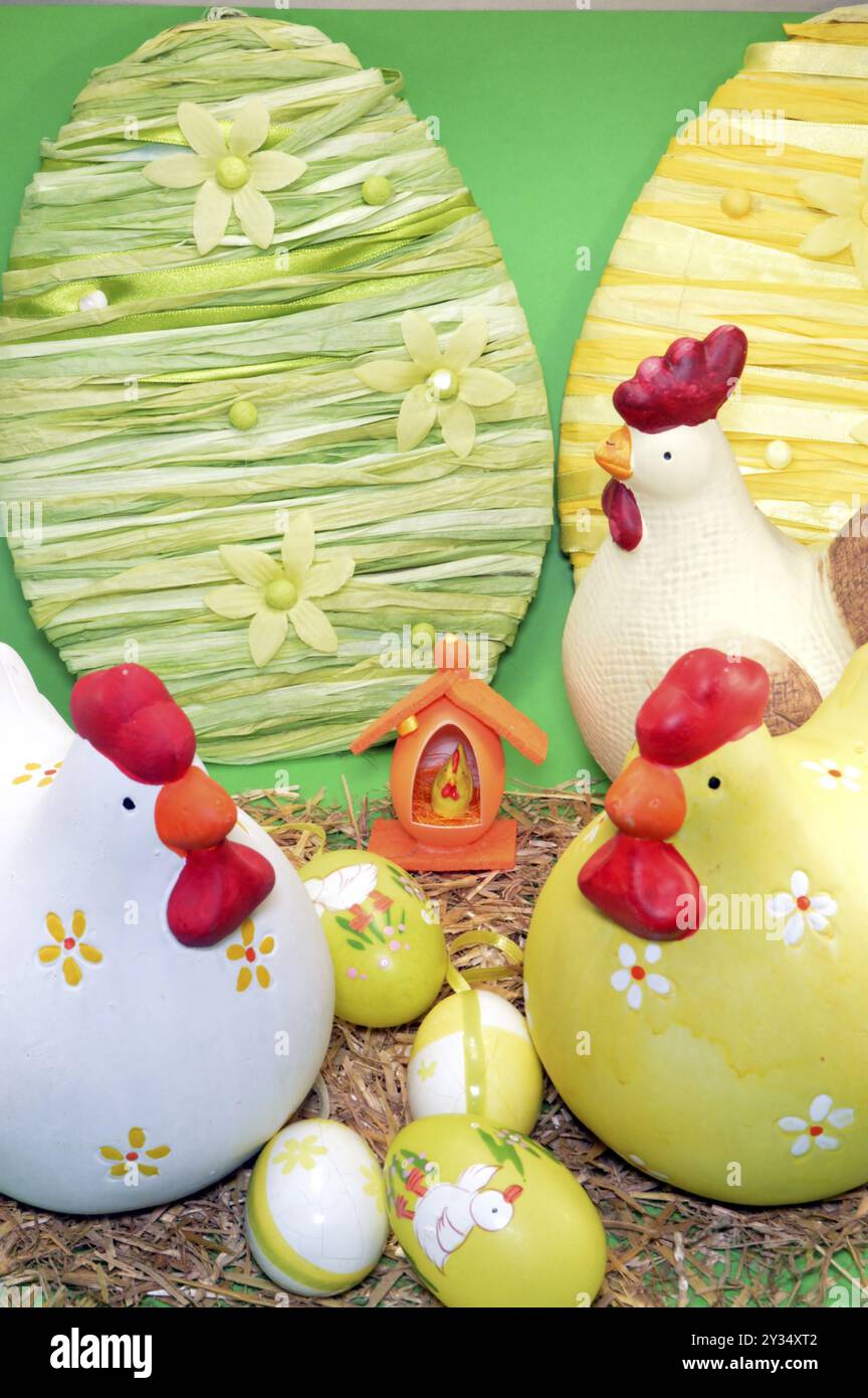 Three hens of Easter with eggs on the straw Stock Photo - Alamy