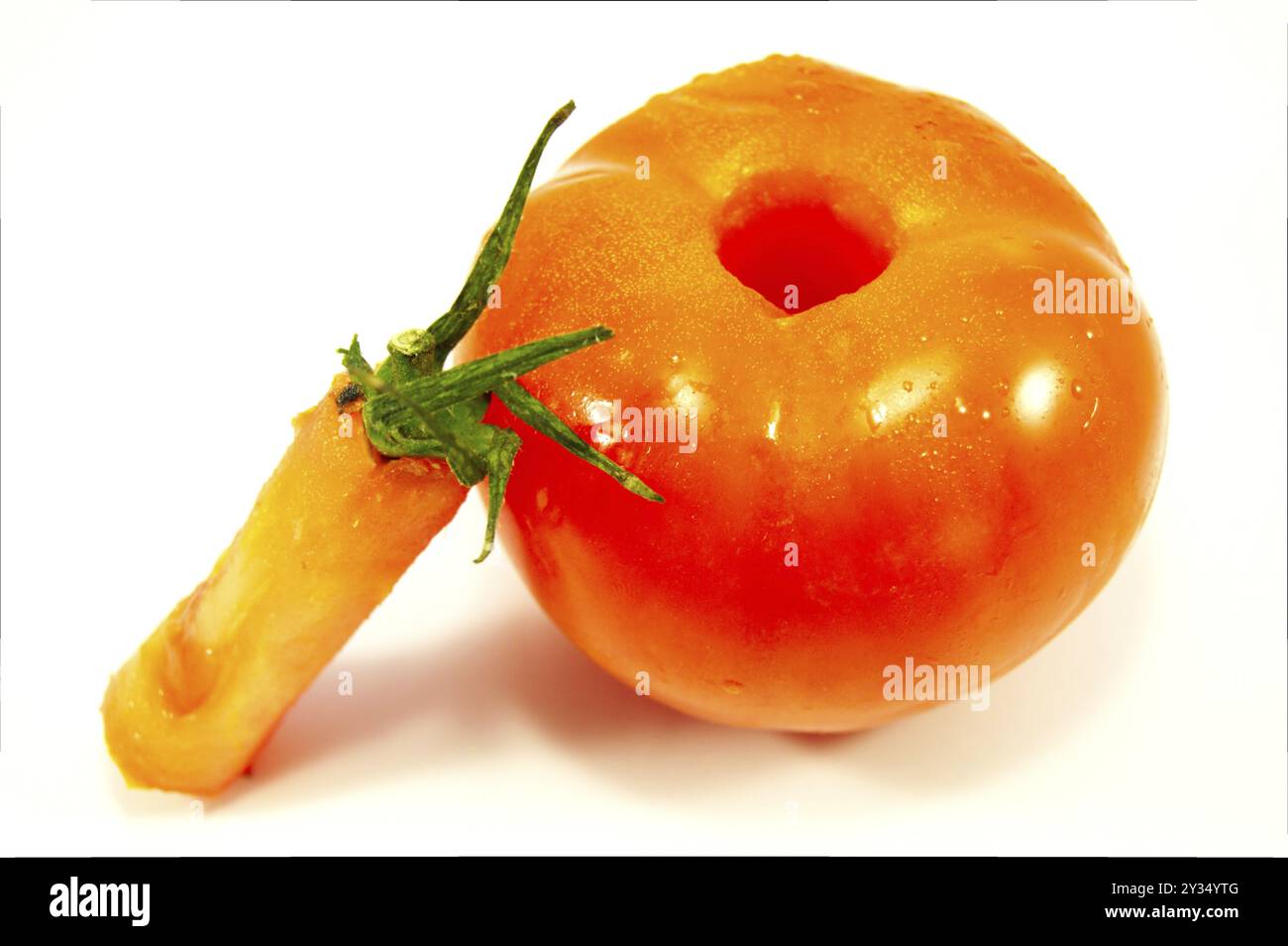 Red tomato deseeded on a white bottom Stock Photo - Alamy