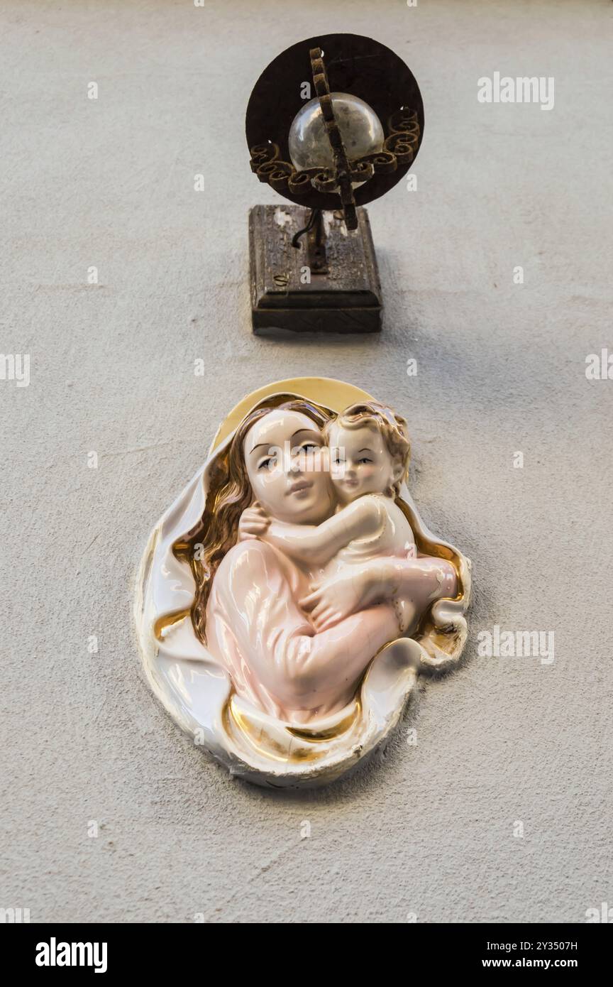 Religious icon. On stone wall of Virgin Mary and the holy child Jesus Stock Photo - Alamy