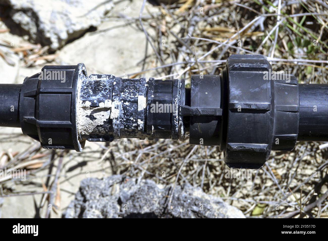 Join plastic water pipe with a muff Stock Photo - Alamy