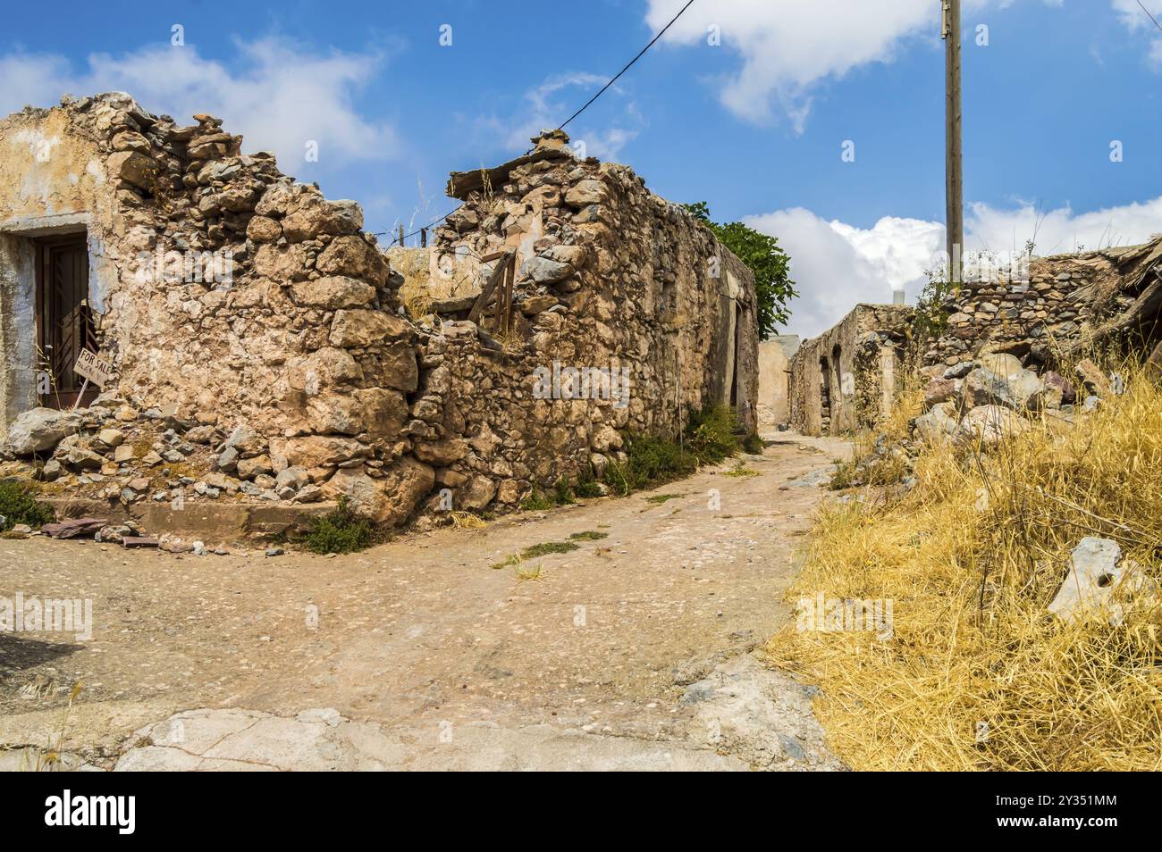 Old abandoned town. Narrow street in old Greek village. Traditional ...