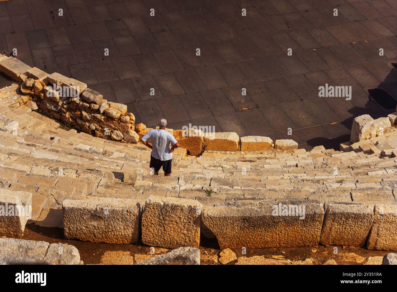 A man in the amphitheater of the ancient city of Patara in Turkey Stock ...