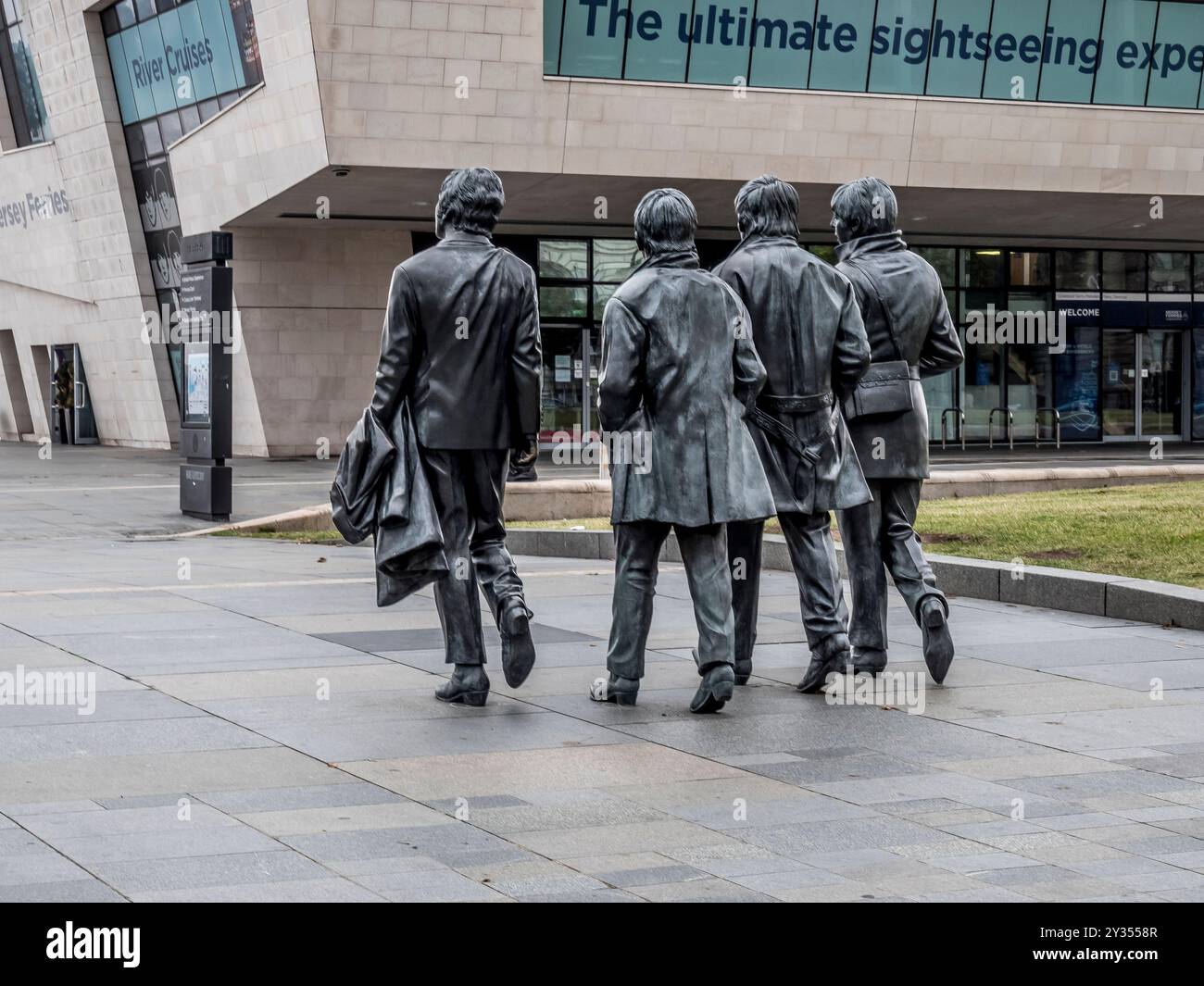 This image is the statue of the Liverpool music group the Beatles who ...