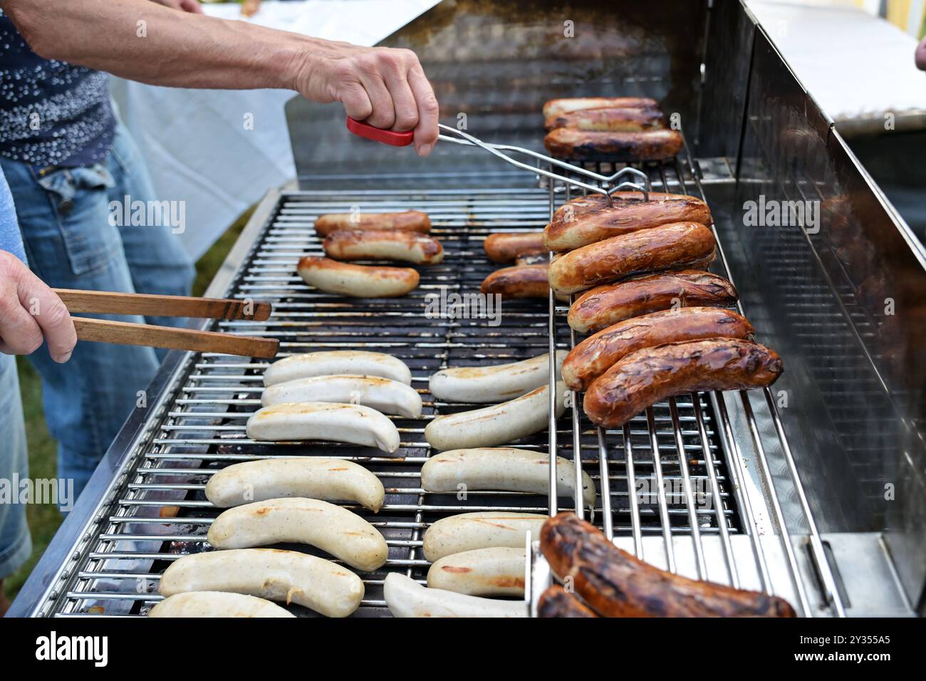 Large grill with sausages for sale at an open-air festival, in Germany ...