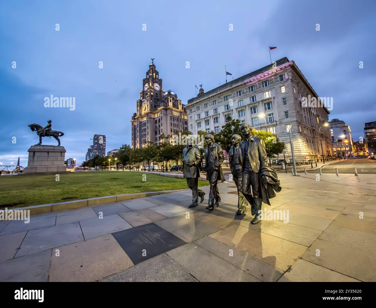 This image is the statue of the Liverpool music group the Beatles who ...