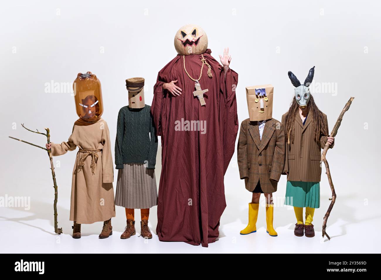Five Halloween characters standing together in creepy costumes and ...