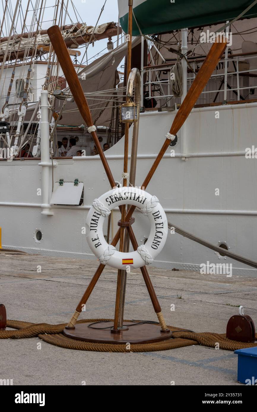 People are waiting in a row to embark the white Spanish tall ship, El ...