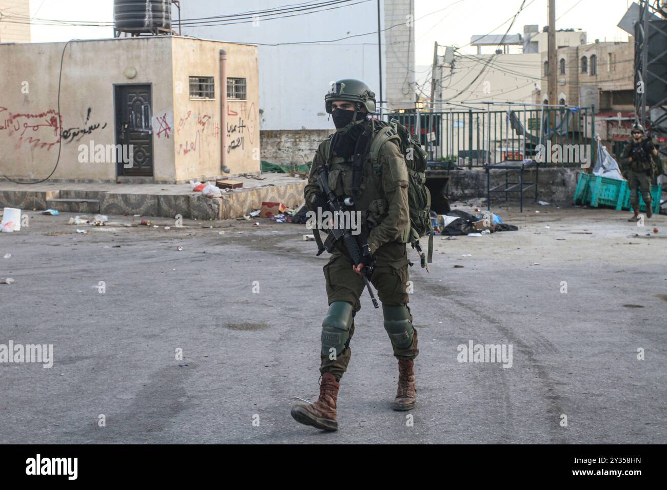 An Israeli infantry soldier seen deploying in the city of Tubas during ...