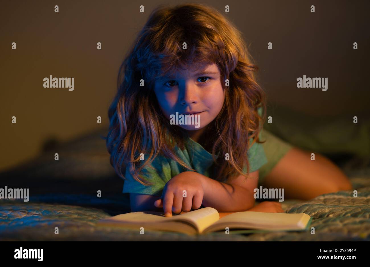 Kids reading books. Child reading a book in bed before going to sleep ...