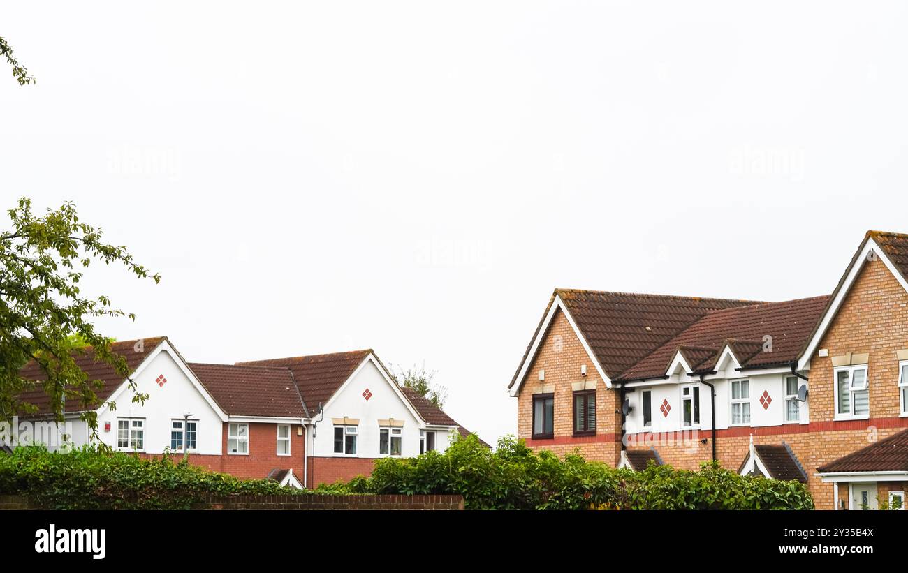 Traditional English house brick roofs, suburban area Stock Photo - Alamy
